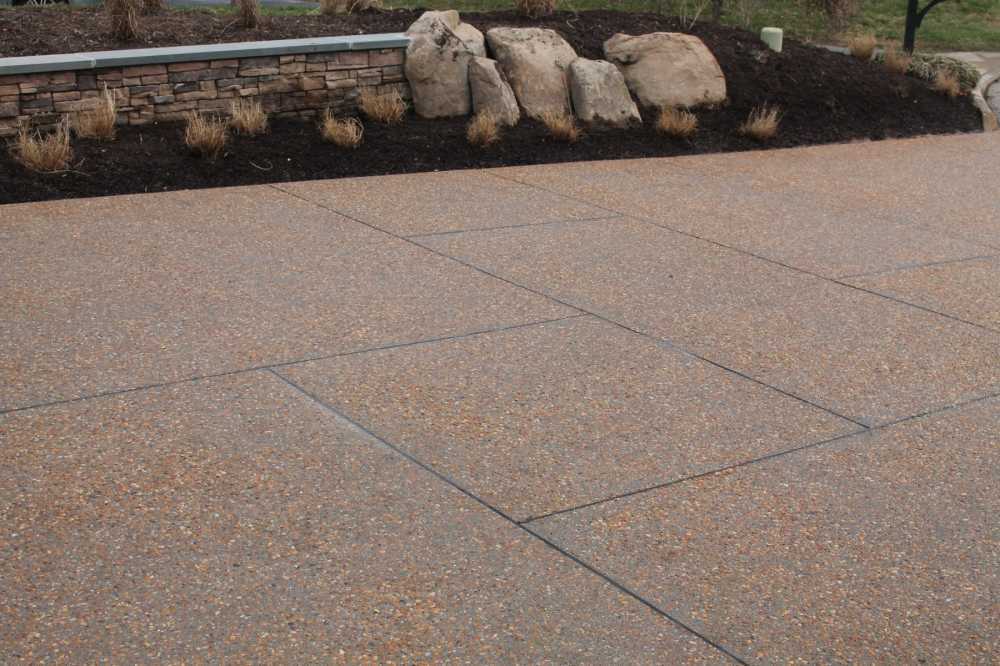 Atlantic designed and installed this exposed aggregate driveway. Concrete was selected to help ...